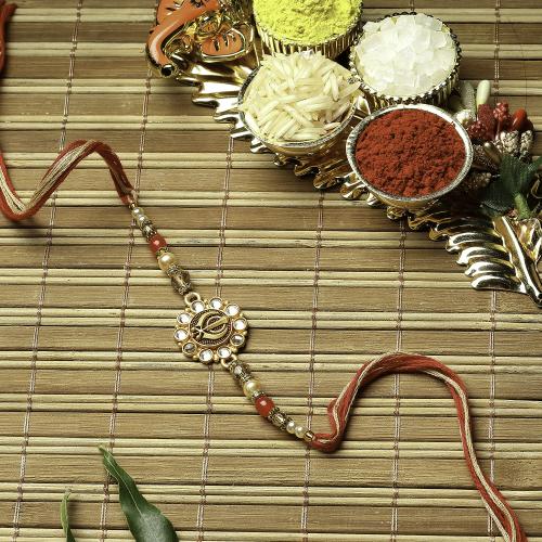 Buy Gold-Toned Khanda (Sikh Symbol) Rakhi for Men with Roli Chawal ...