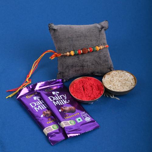 Buy Designer Rudraksh Rakhi with two Cadbury Chocolate Pack Of 1 Online ...