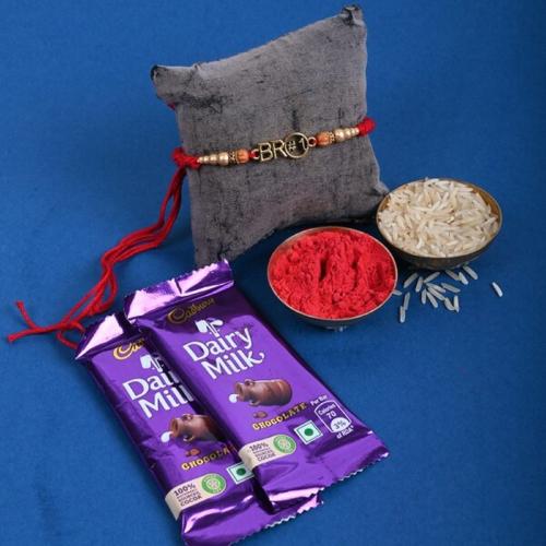 Buy Designer Rudraksh Rakhi with two Cadbury Chocolate Pack Of 1 Online ...