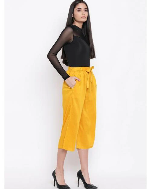Buy RIVI Women Mustard Knotted Rayon Capri Trousers Online at Best ...