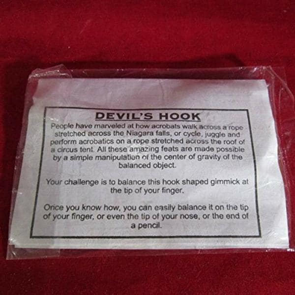 close up classical devil s hook balancing magician hook on finger magic ...